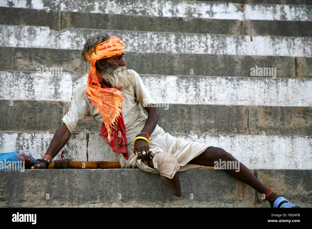 Legged old Sadhu standing up on the stairs of a ghat in Varanasi Stock ...