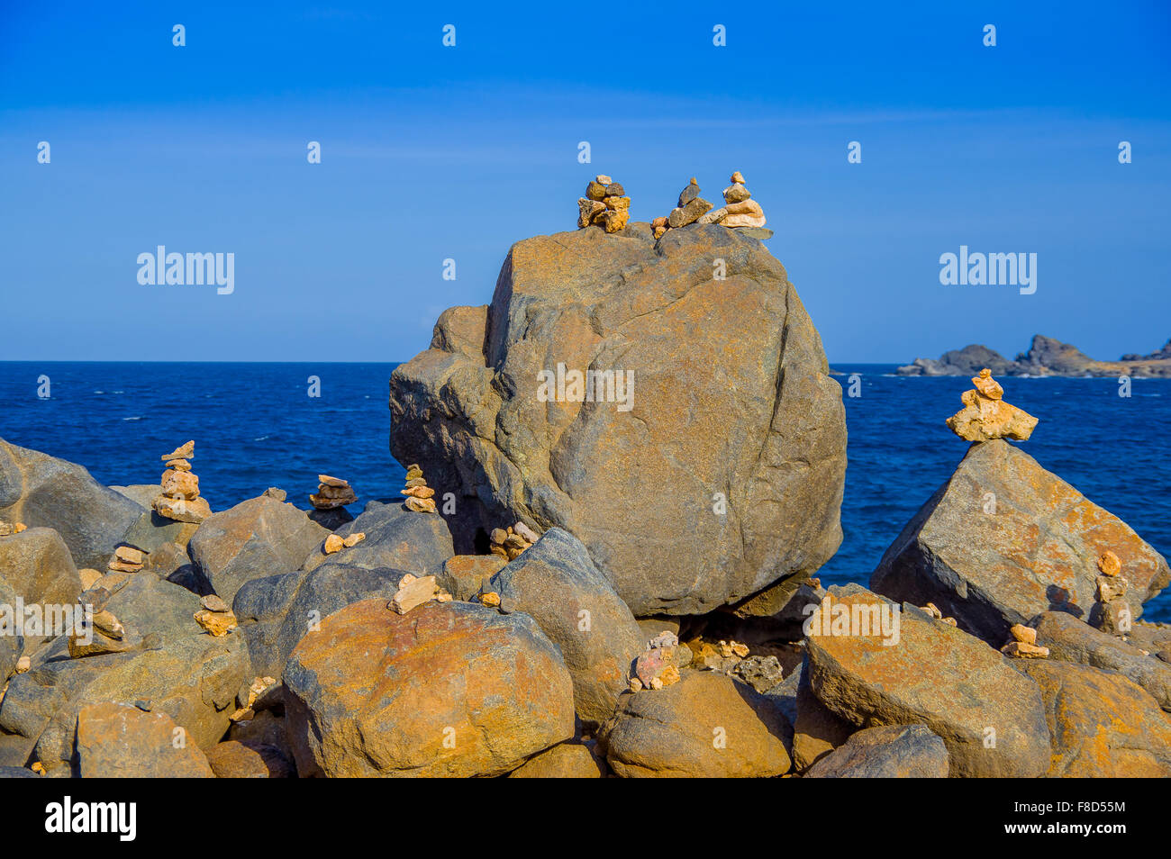 Stack of stones on sea shore, Aruba Stock Photo - Alamy