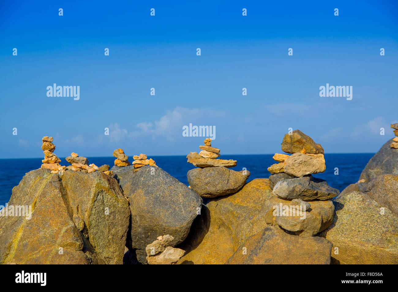 Stack of stones on sea shore, Aruba Stock Photo - Alamy