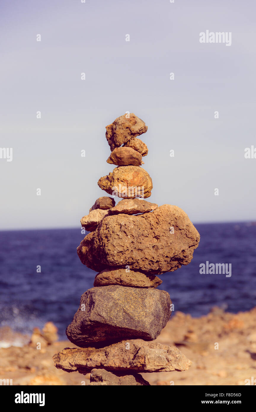 Stack of stones on sea shore, Aruba Stock Photo - Alamy