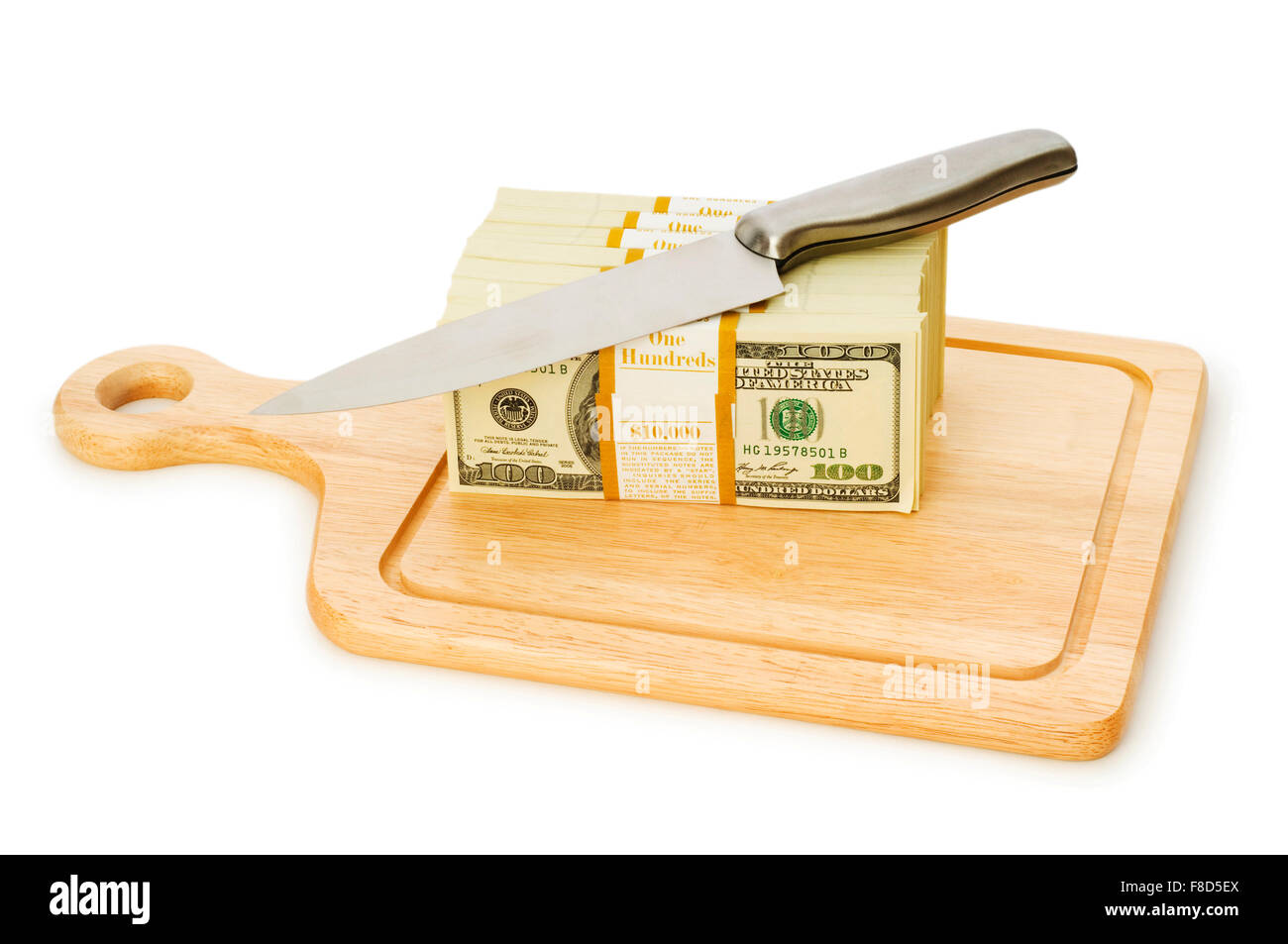 Money concept - cutting dollars with the knife Stock Photo - Alamy