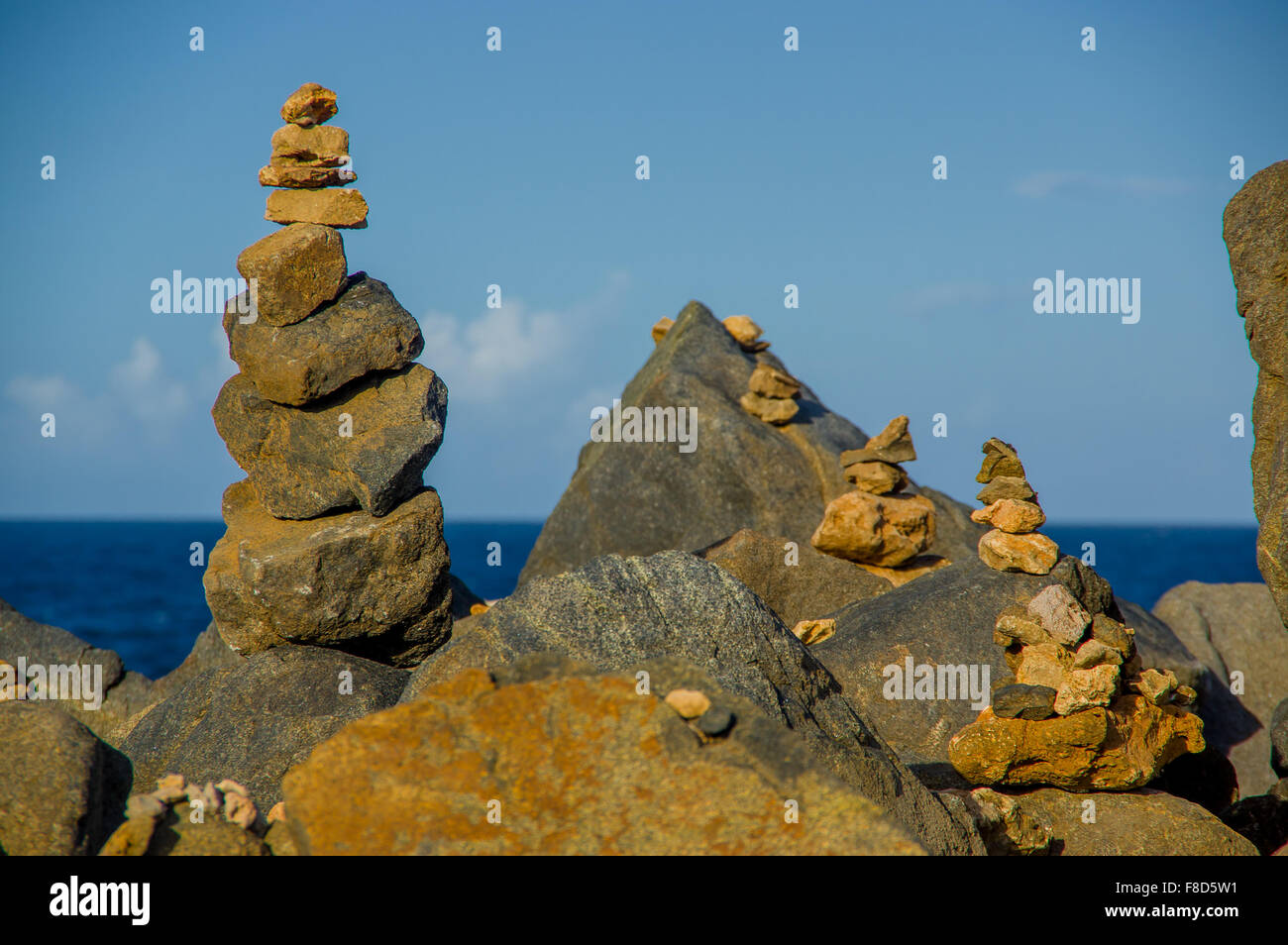 Stack of stones on sea shore, Aruba Stock Photo - Alamy