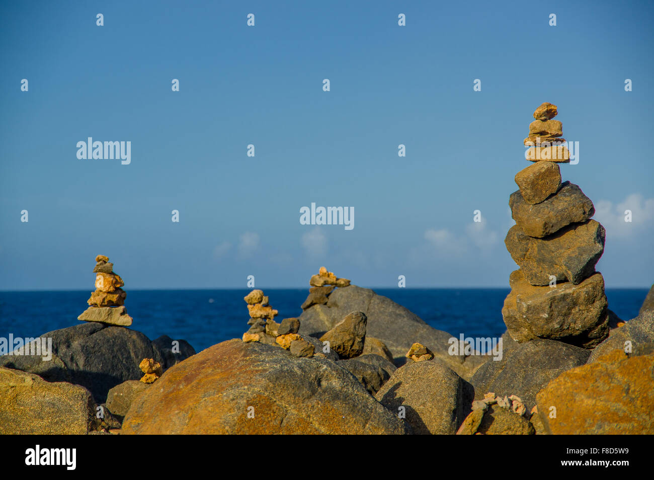 Stack of stones on sea shore, Aruba Stock Photo - Alamy