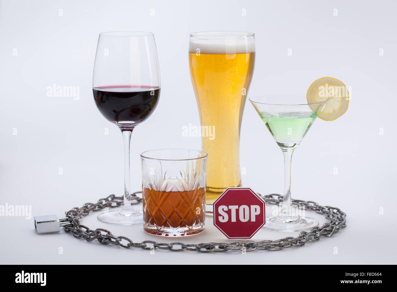 Variety of alcohol with a sign of STOP surrounded by a chain and lock ...