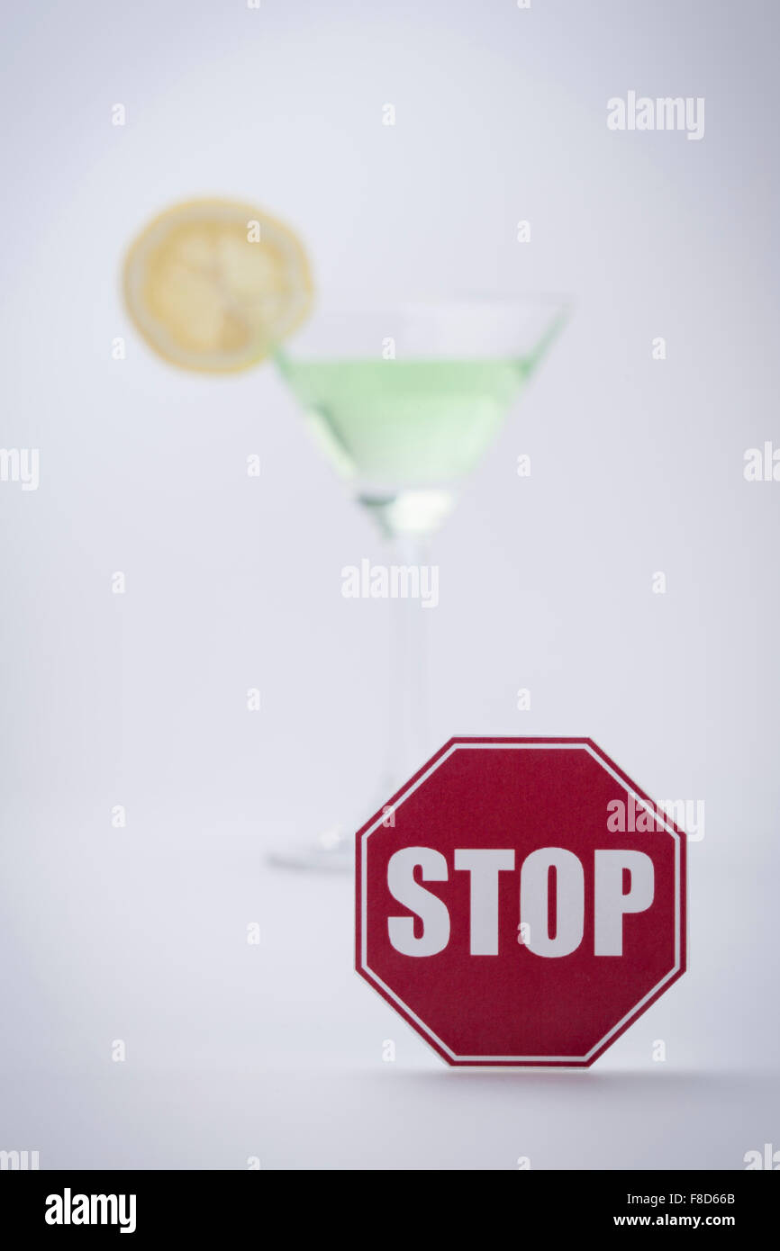 Stop sign with the background of a glass of alcohol Stock Photo - Alamy