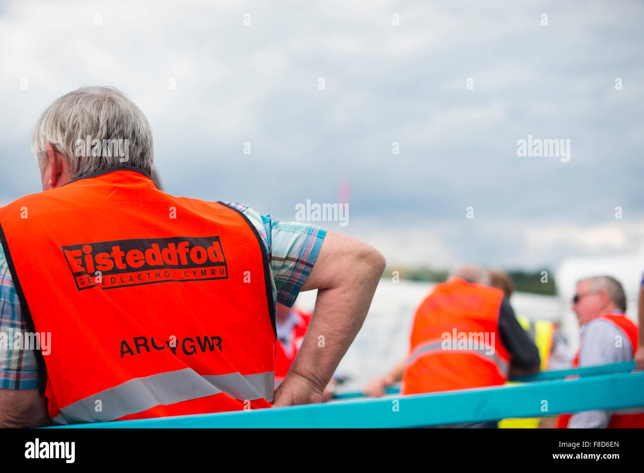 A supervisor wearing an orange branded hi-vis tabard at The National ...
