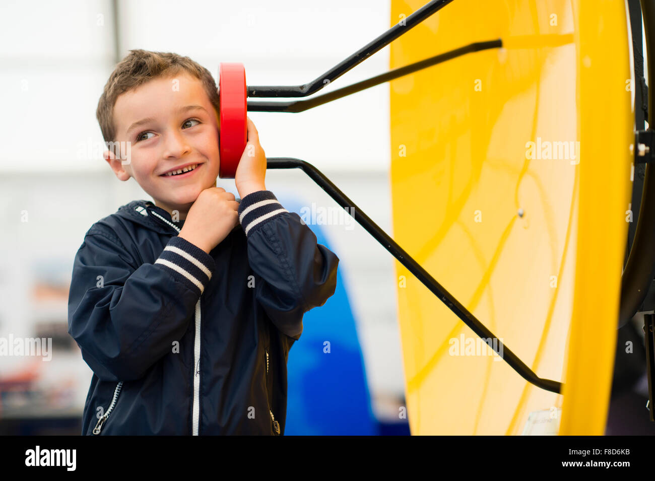 A young boy child interacting with one of the exhibits at the Science ...