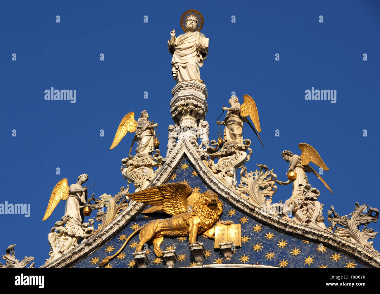 Beautiful spires, friezes, and statues of San Marco Basilica in Venice ...