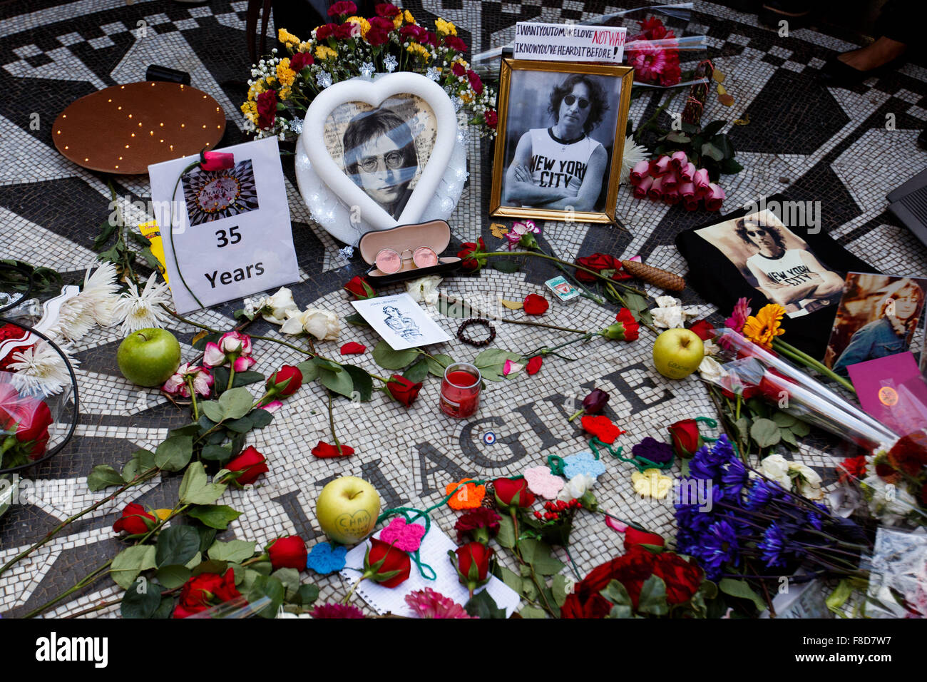 New York. 8th Dec, 1980. Photos of John Lennon and flowers are placed ...