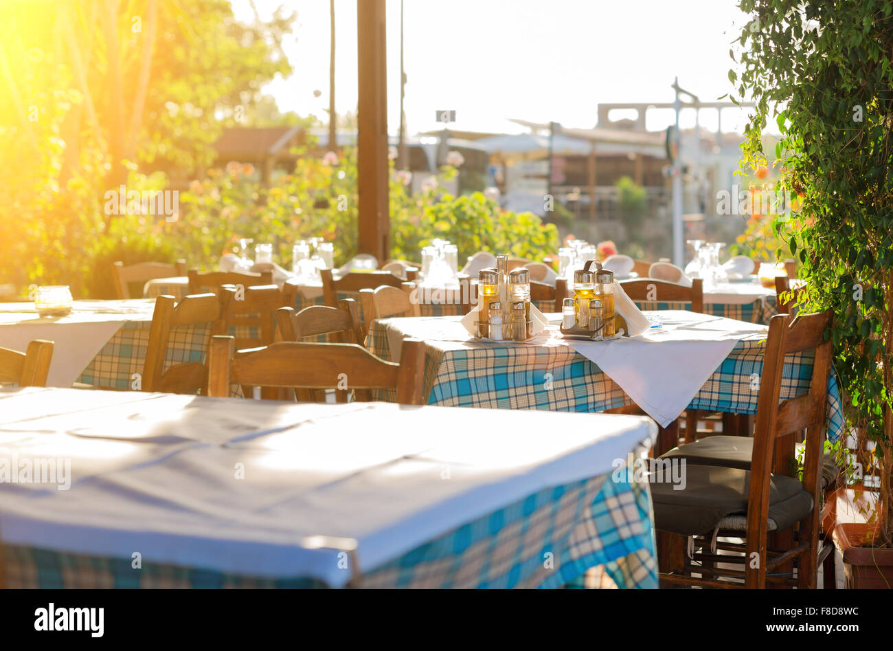 Mediterranean cafe terrace exterior with chairs Stock Photo - Alamy