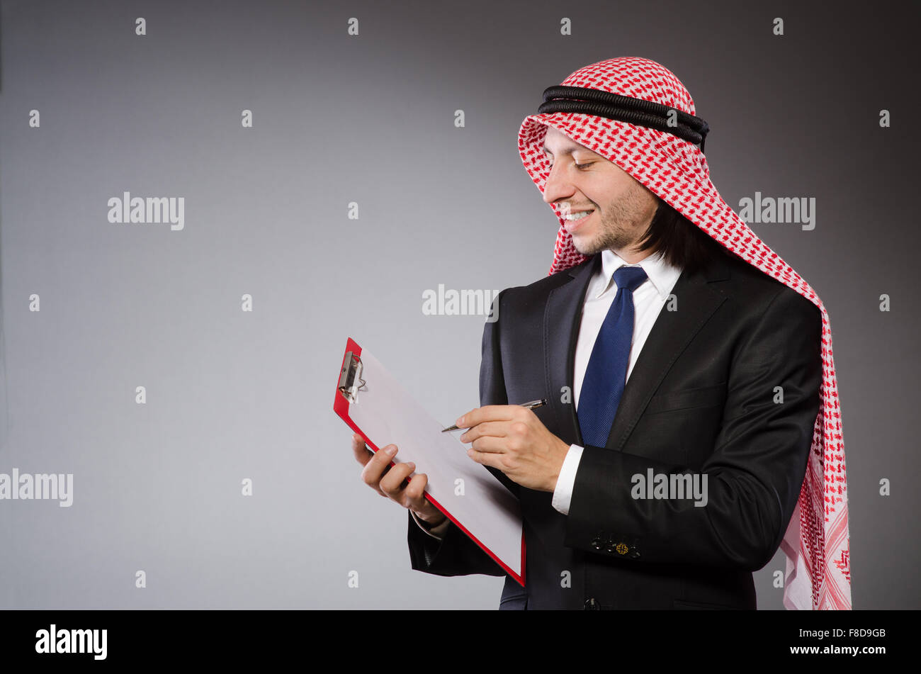 Arab man with paper binder Stock Photo - Alamy