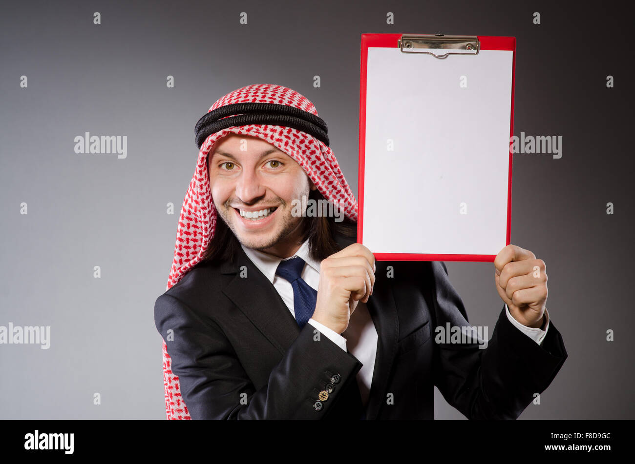 Arab man with paper binder Stock Photo - Alamy