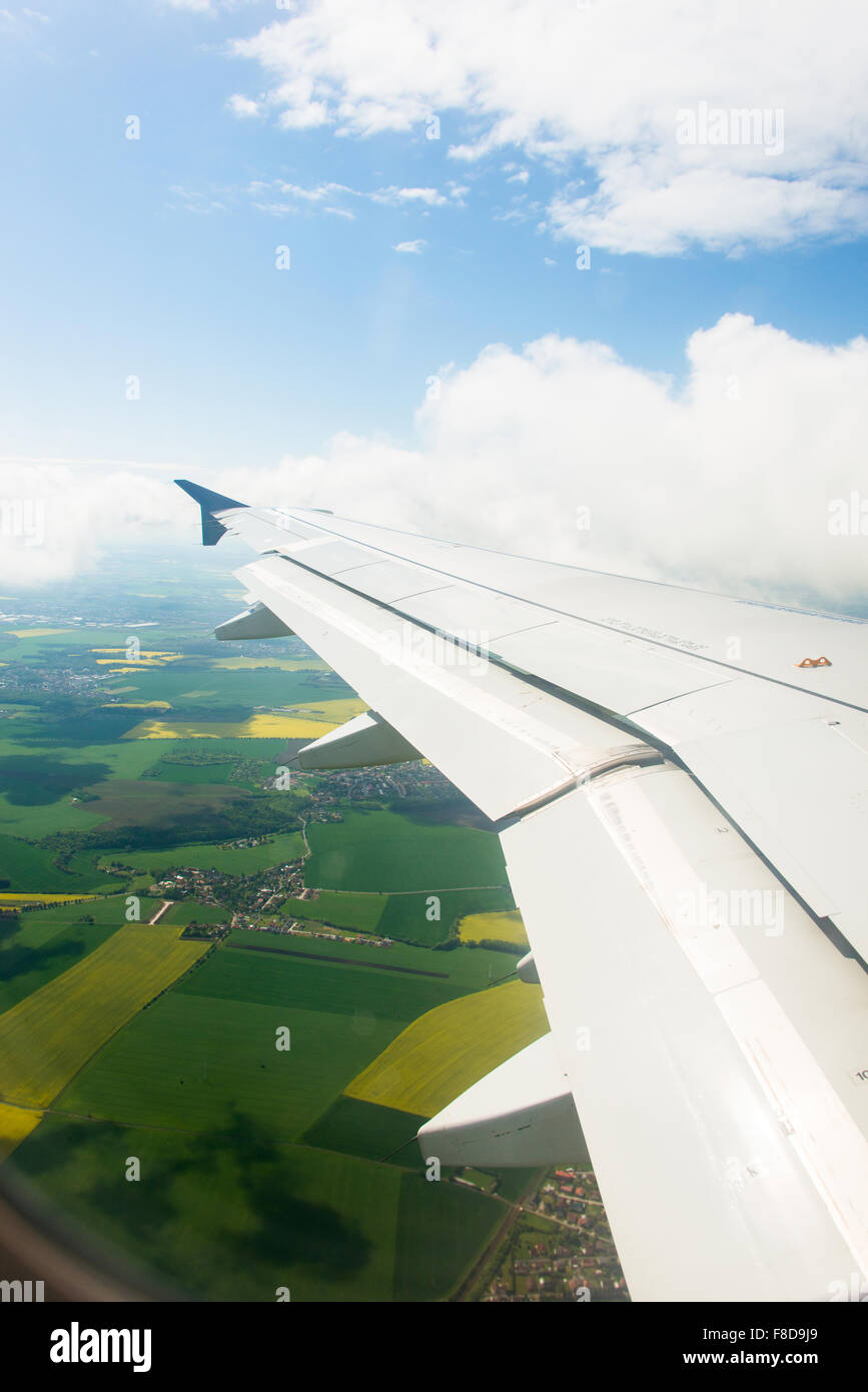 Airplane wing out of window Stock Photo - Alamy