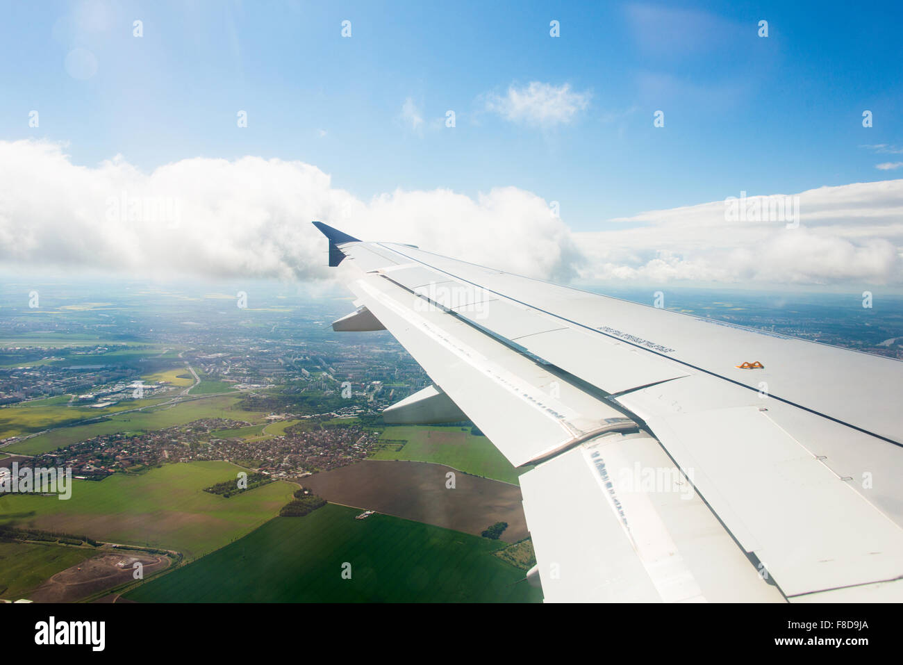 Airplane wing out of window Stock Photo - Alamy