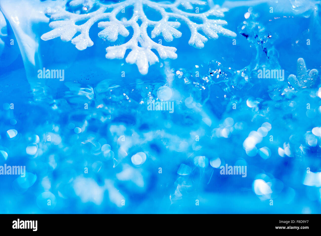 snowflake melts in water bokeh abstract seasonal background Stock Photo ... snowflake melts in water bokeh abstract seasonal background Stock Photo ...