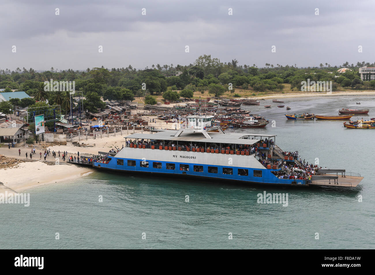 Crowded vehicle and passenger ferry MV Magogoni at Dar es Salaam ...