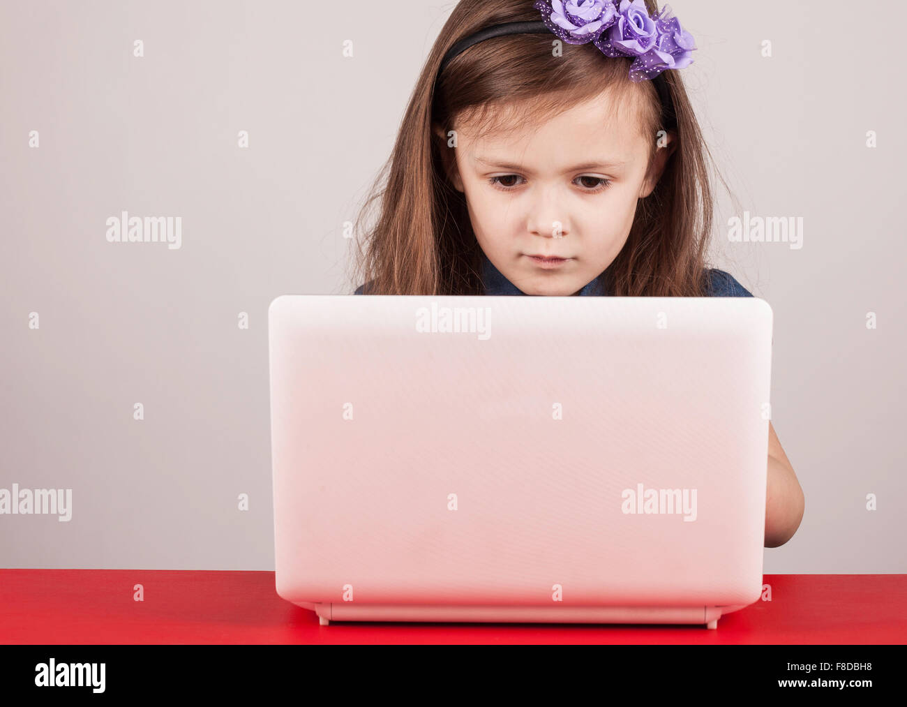 girl child with computer Stock Photo - Alamy