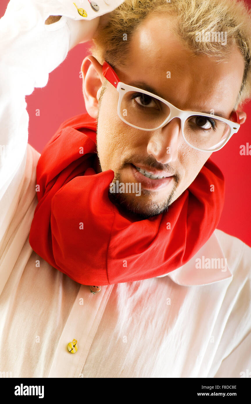 Man with red scarf against coloured background Stock Photo - Alamy