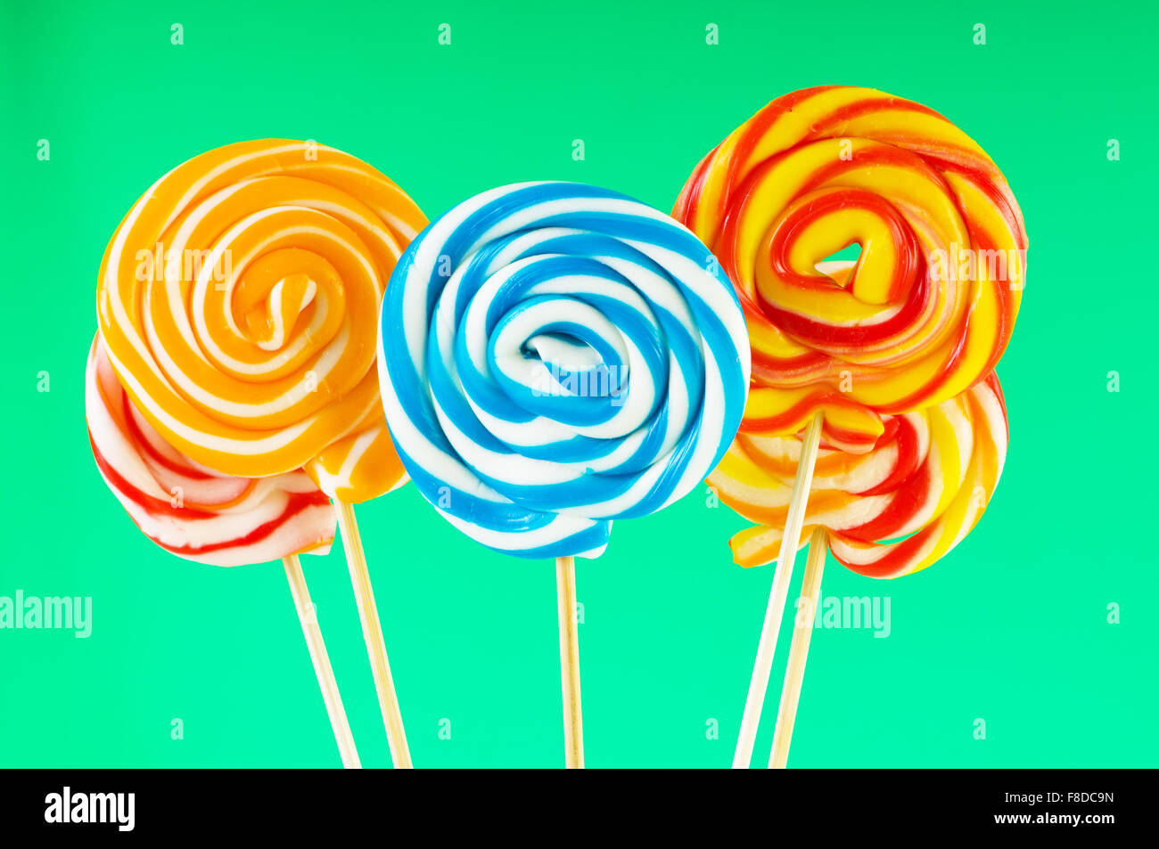 Colourful lollipop against the colourful background Stock Photo - Alamy