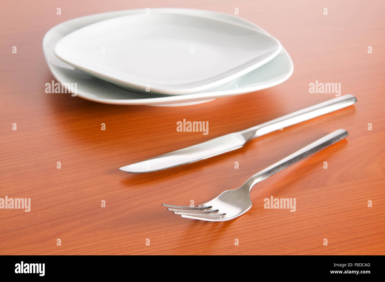 Set of utensils arranged on the table Stock Photo - Alamy