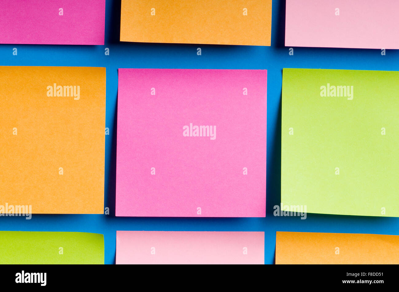 Reminder notes on the bright colorful paper Stock Photo - Alamy