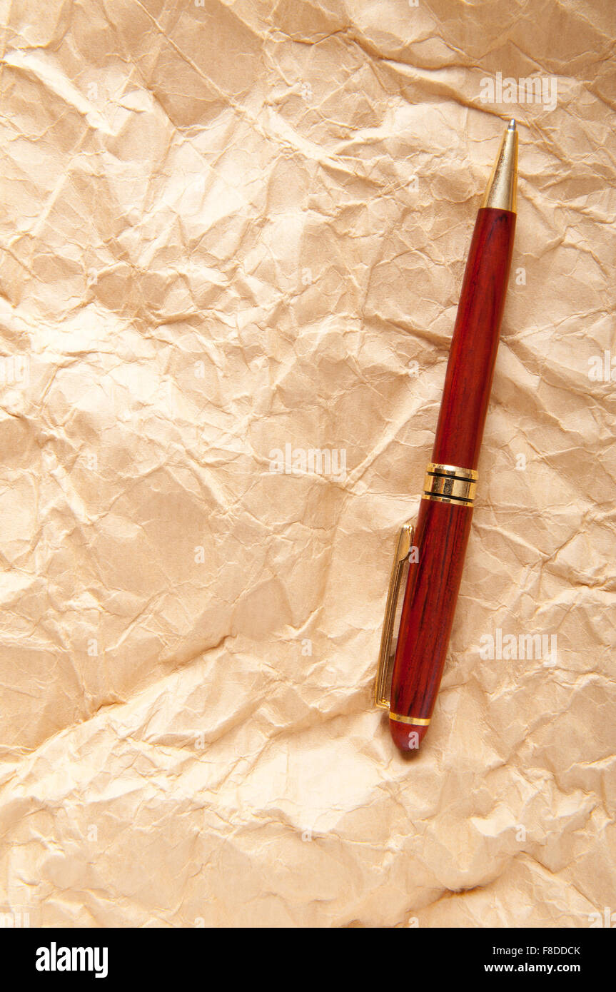 Paper background with pen Stock Photo - Alamy