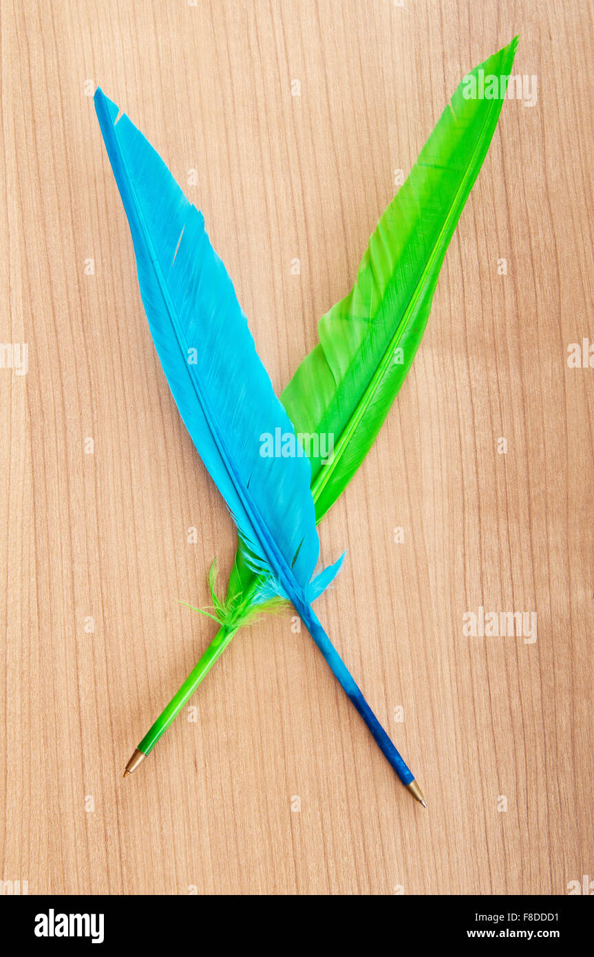 Paper and feather in vintage writing concept Stock Photo - Alamy