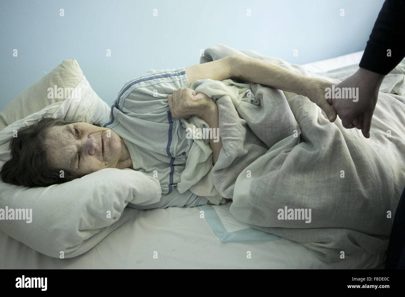 Omsk, Western Siberia, Russia. 29th May, 2015. Woman in her bed at the ...