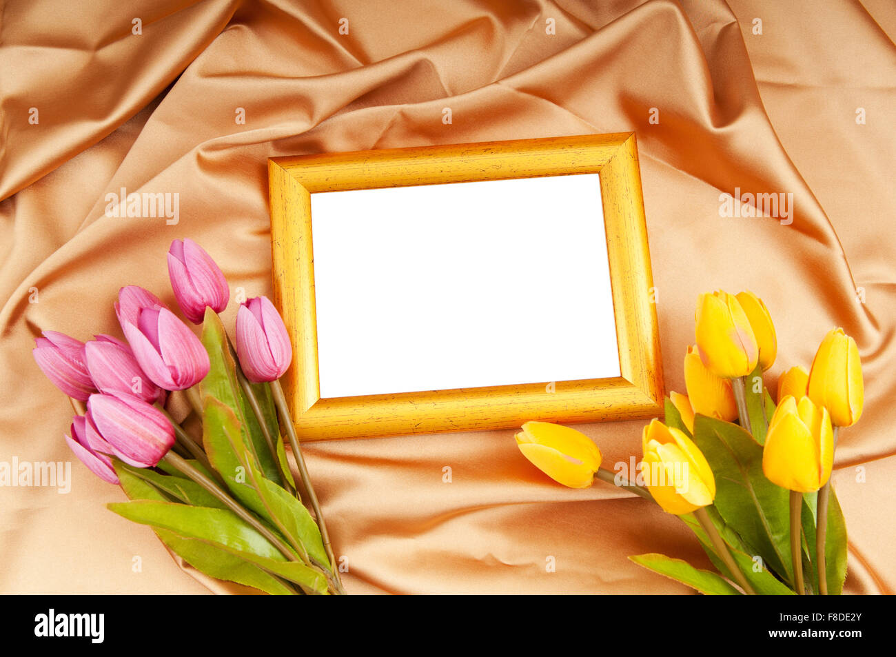 Picture frames and tulips flowers on satin Stock Photo - Alamy