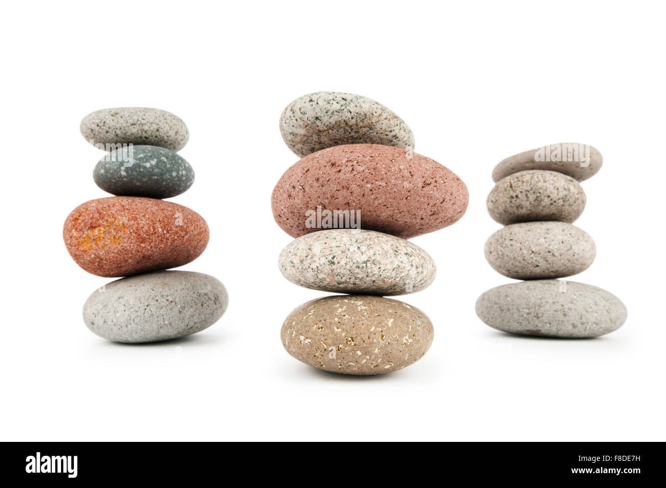 Stack of pebbles isolated on the white Stock Photo - Alamy