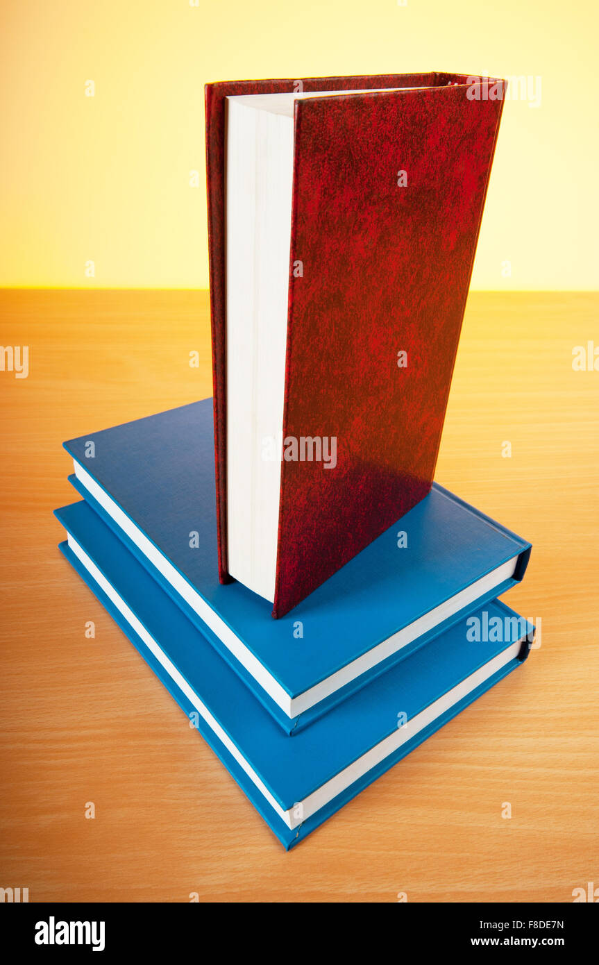 Stack of text books against gradient background Stock Photo - Alamy