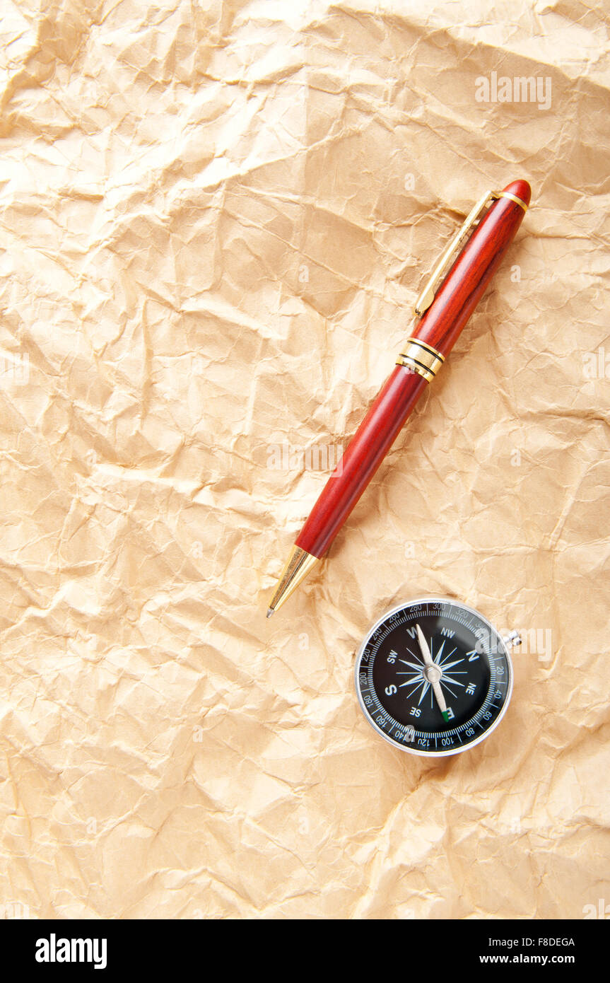 Vintage compass on the paper in adventure concept Stock Photo - Alamy