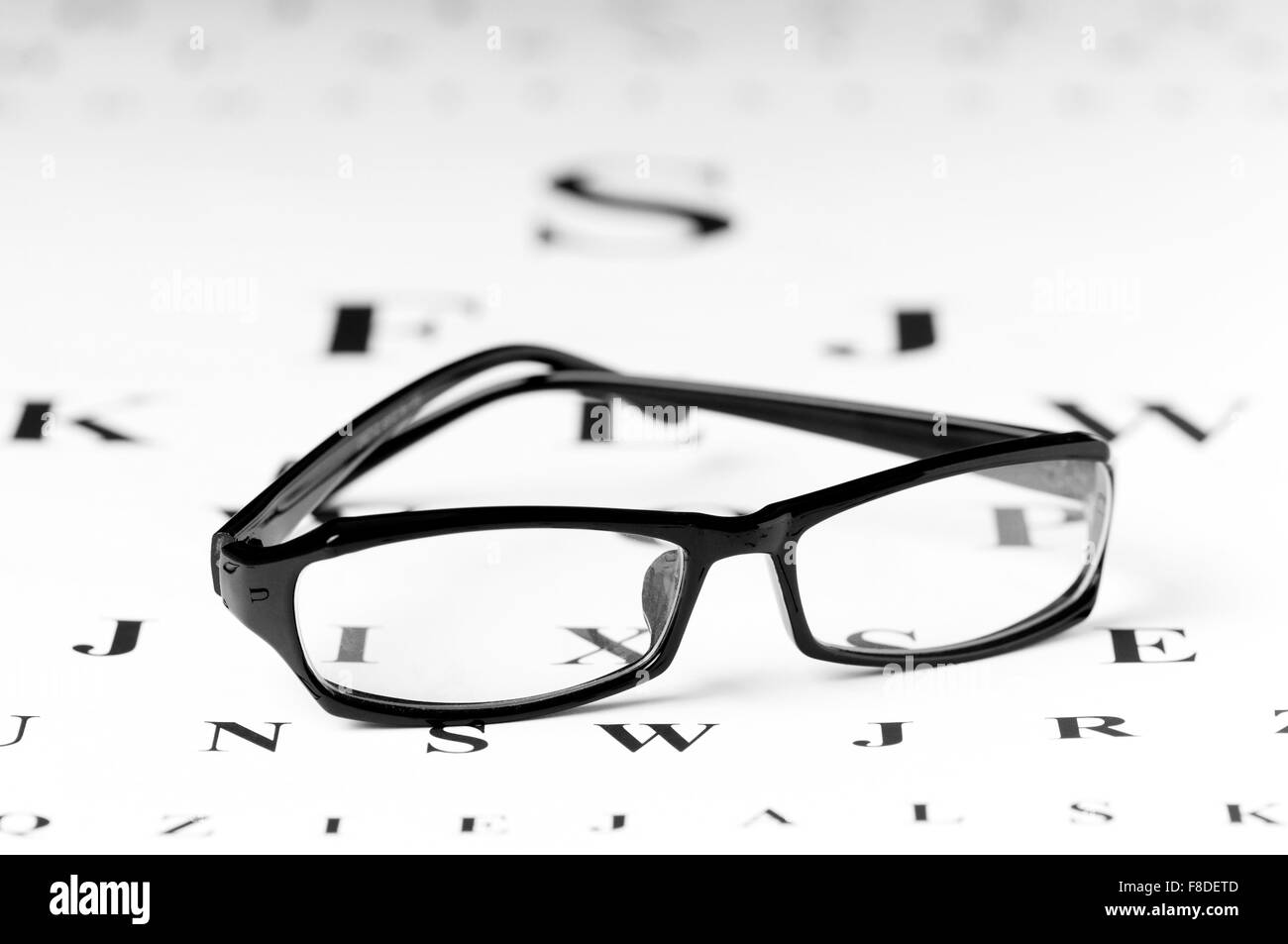 Optical reading glasses on the eyesight table Stock Photo - Alamy