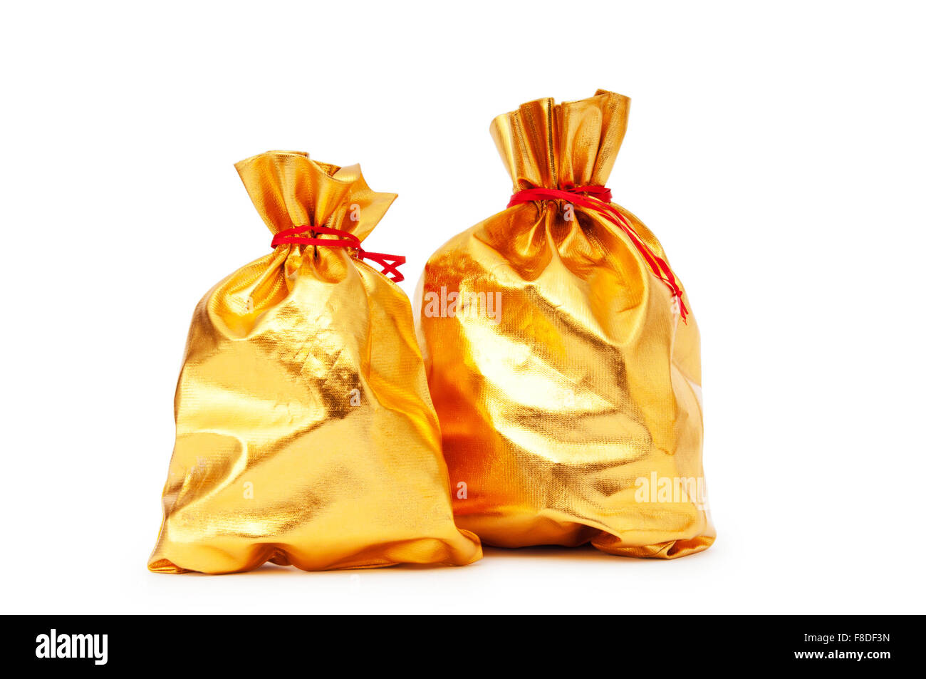 Golden sacks full of something good Stock Photo - Alamy