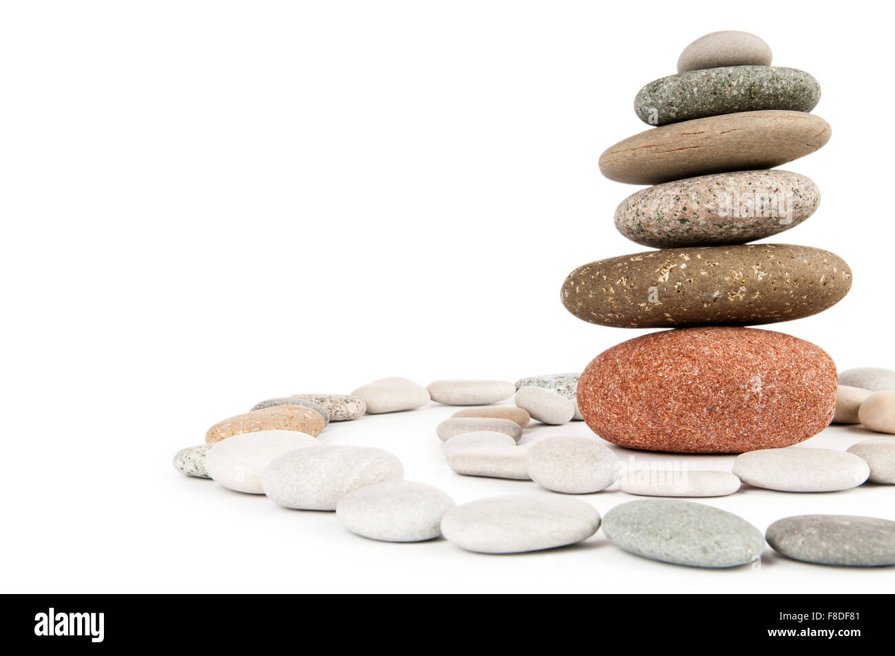 Stack of pebbles isolated on the white Stock Photo - Alamy