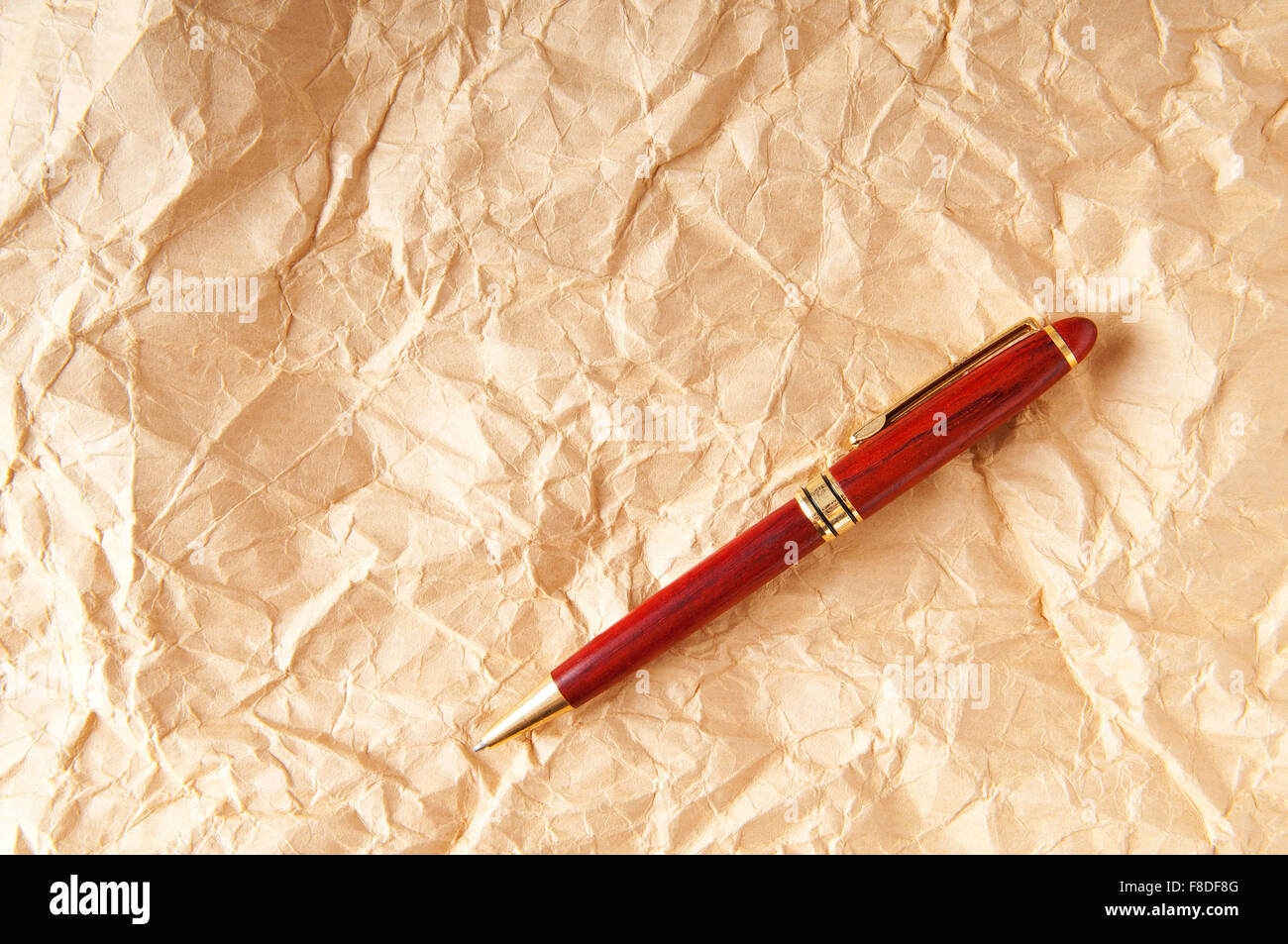 Paper background with pen Stock Photo - Alamy