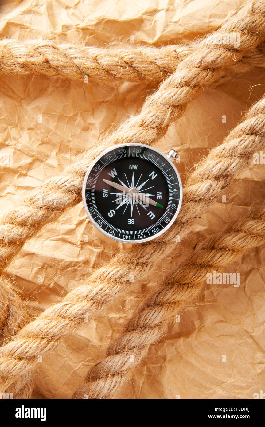 Compass and rope in travel and adventure concept Stock Photo - Alamy