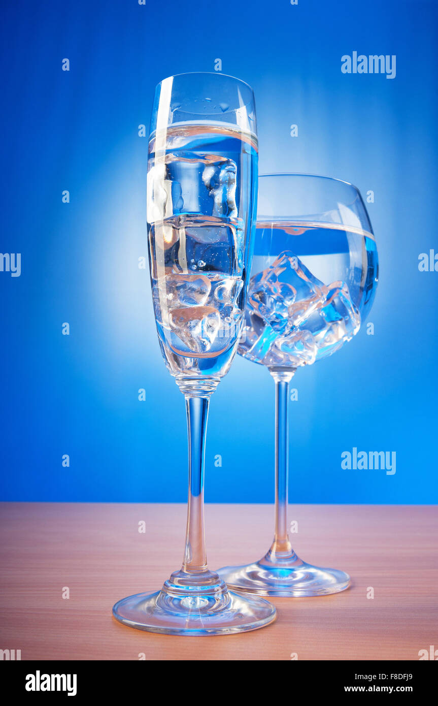 Water in the glass against gradient background Stock Photo - Alamy