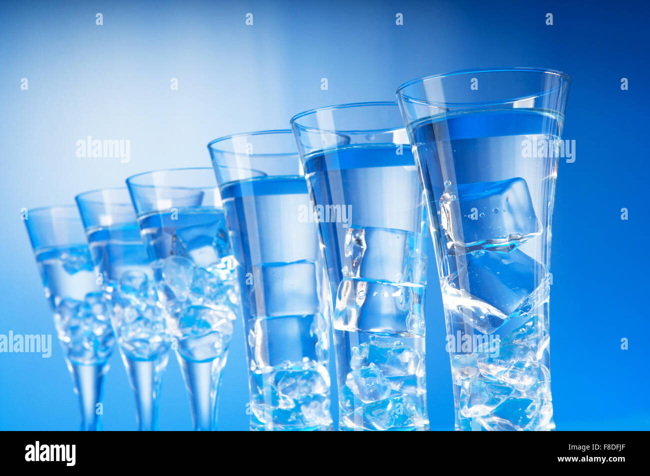 Water in the glass against gradient background Stock Photo - Alamy