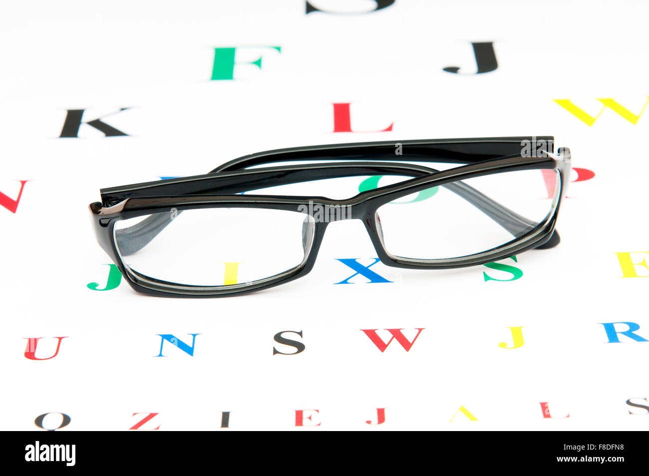 Optical reading glasses on the eyesight table Stock Photo - Alamy