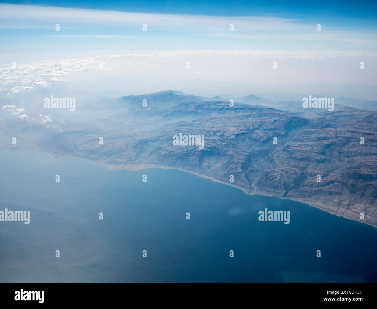 Aerial view of Oman coastline along Arabian Sea from airplane window ...