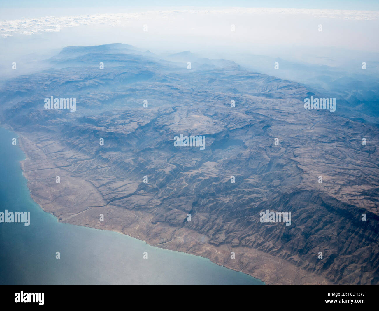 Aerial view of Oman coastline along Arabian Sea from airplane window ...