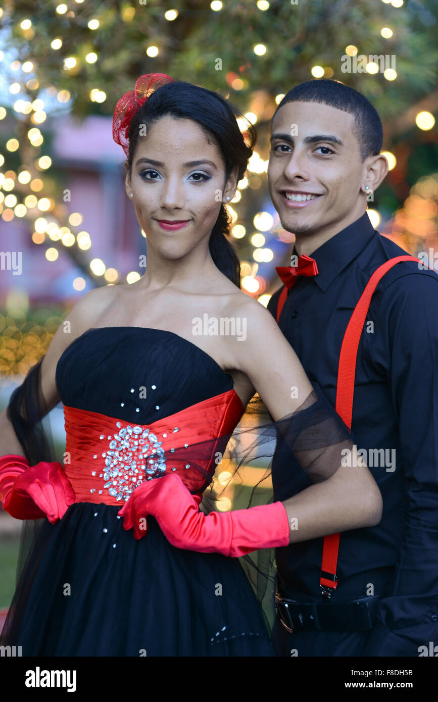 Puertorican (hispanic) teenager couple participating at a quinceanera ...