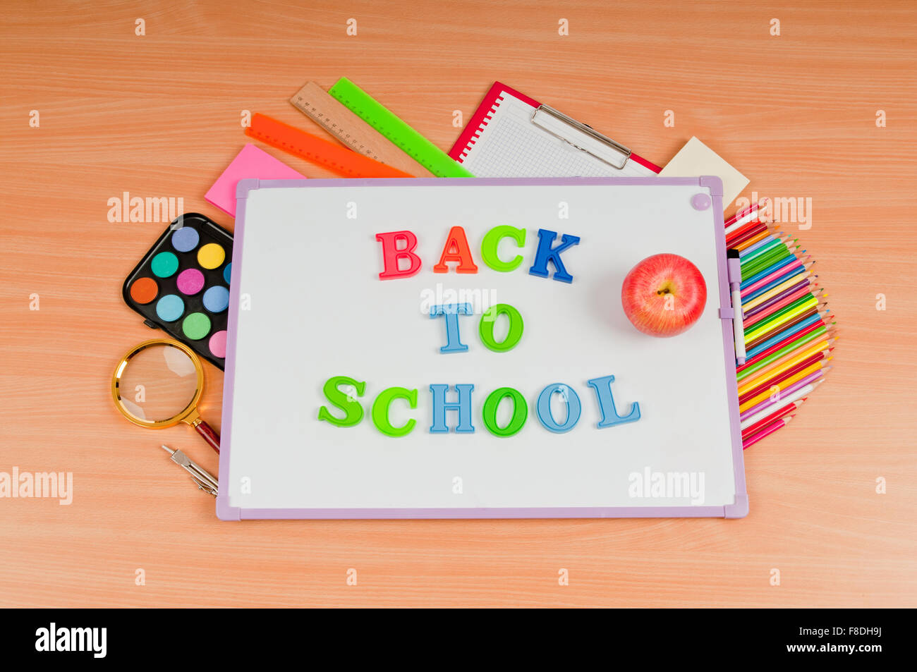 School items on the desk Stock Photo - Alamy
