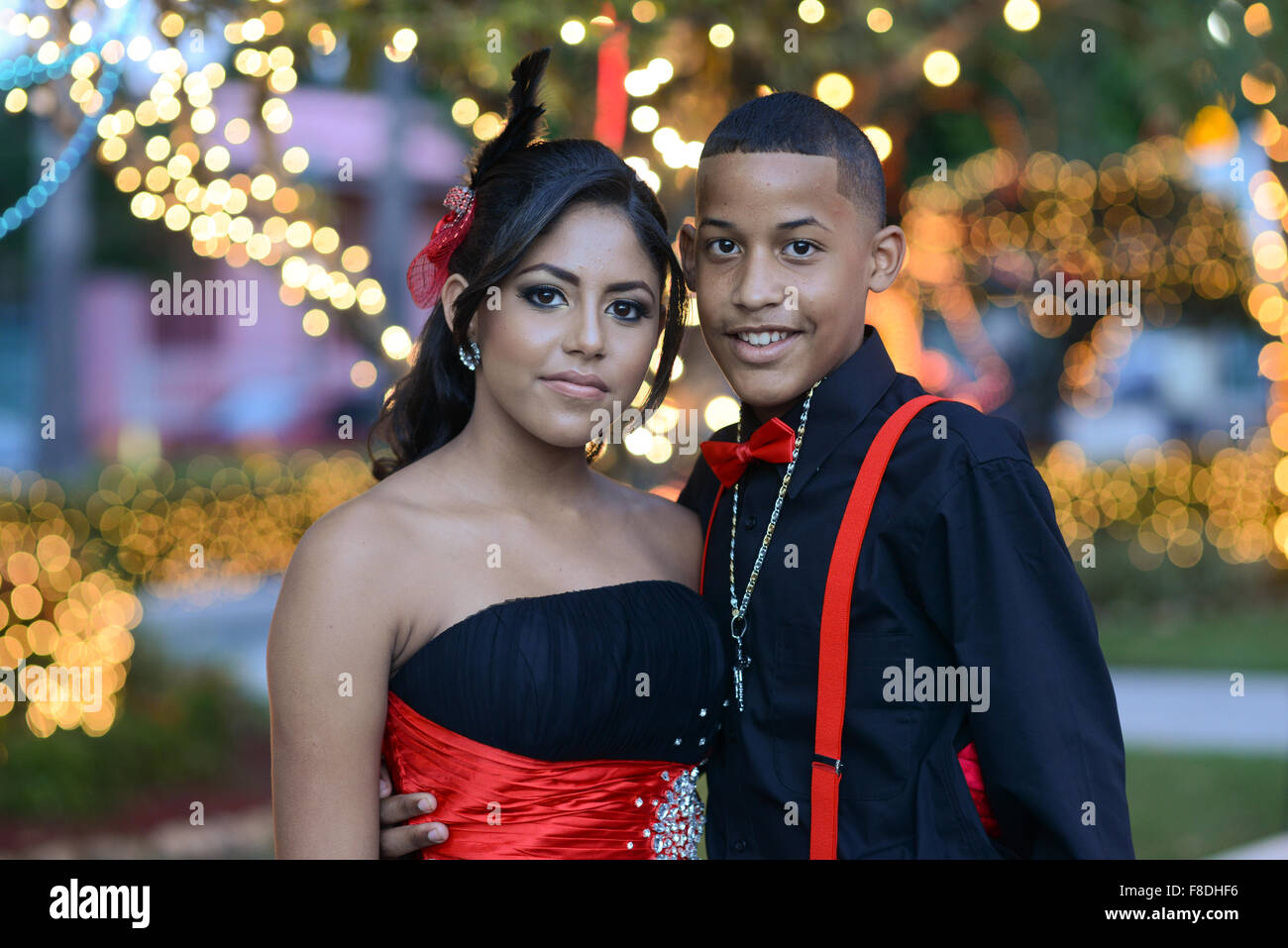 Puertorican (hispanic) teenager couple participating at a quinceanera ...