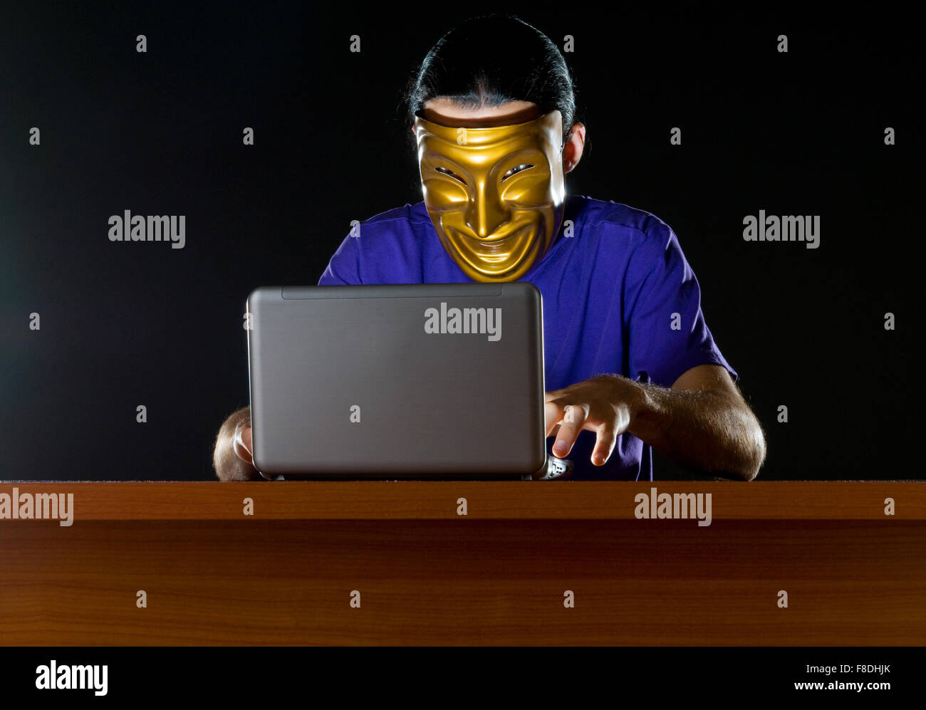 Hacker sitting in dark room Stock Photo - Alamy