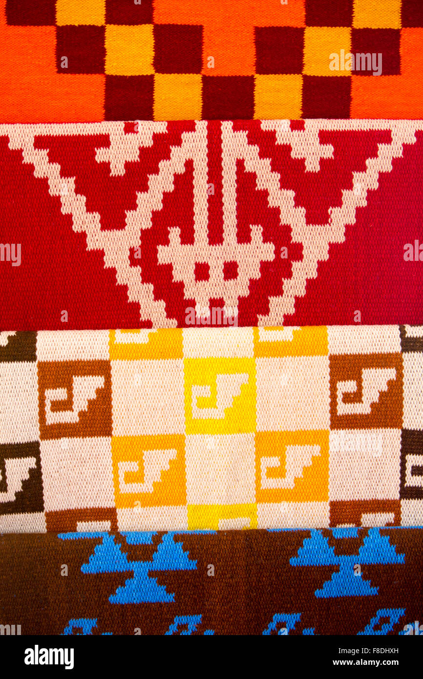 Colored fabrics with signs from Peruvian indigenous market Stock Photo ...