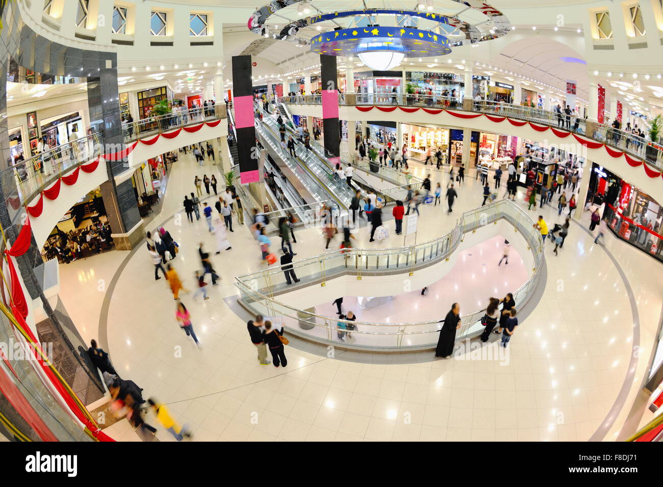crowd shopper people in Interior of a modern shopping mall center Stock Photo - Alamy