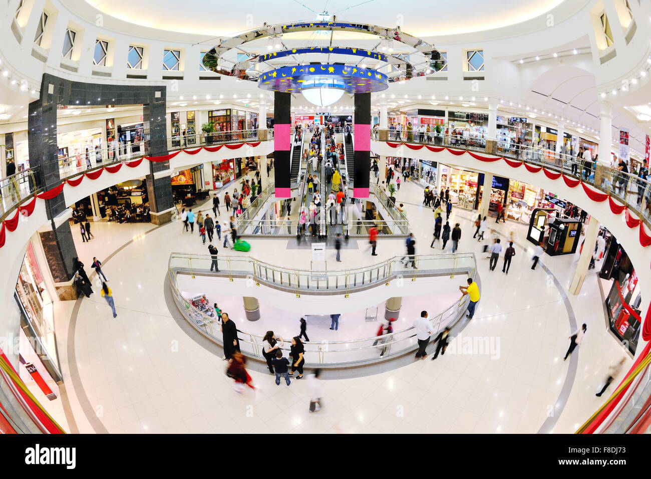 crowd shopper people in Interior of a modern shopping mall center Stock Photo - Alamy