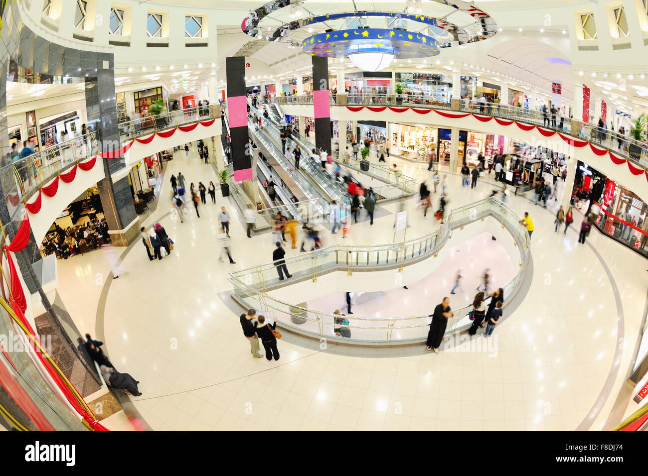 crowd shopper people in Interior of a modern shopping mall center Stock Photo - Alamy